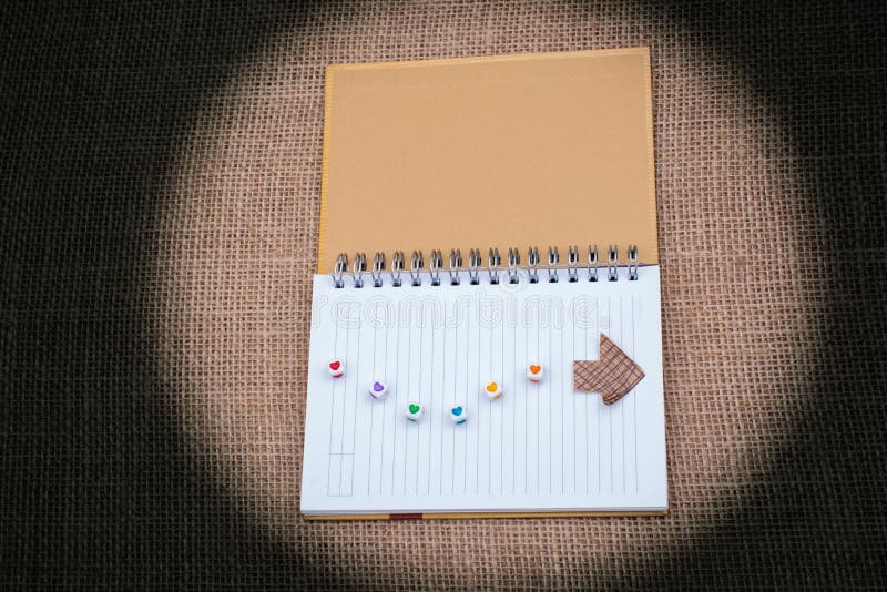 Love Cubes and Paper Arrow on a Notebook Stock Image - Image of ...