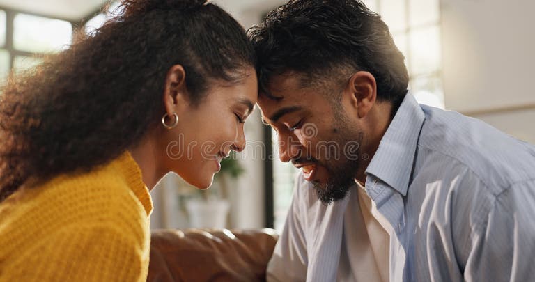 Love, Forehead and Smile with Couple on Sofa for Romantic Connection, Support and Trust ...