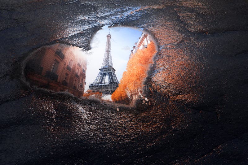 Love France Concept. Reflection of Eiffel Tower through Puddle in Shape ...