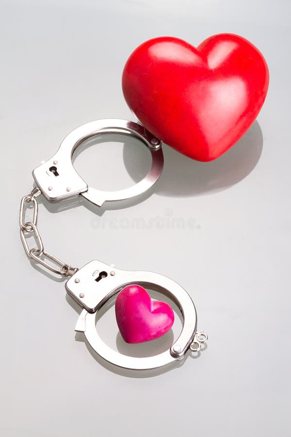 Love in handcuffs stock photo. Image of handcuffs, abstract - 29043302