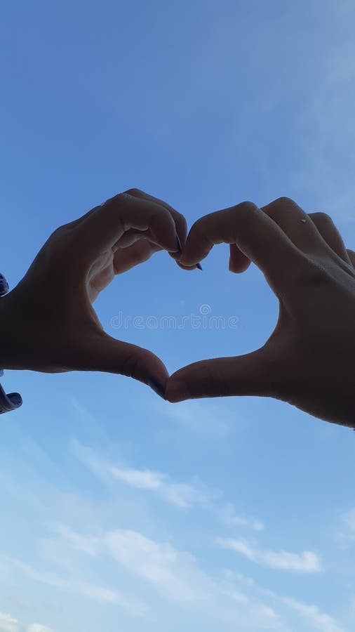 Love Logo Made by Two Hands Couple Under Blue Sky Stock Image - Image ...