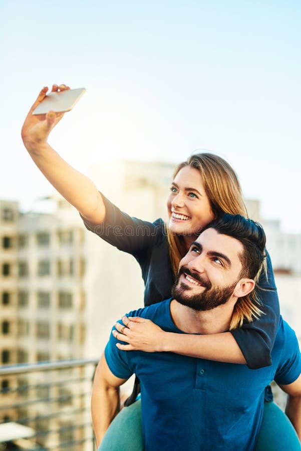 We Love Looking Back at Selfies. a Young Couple Taking a Selfie Outside ...