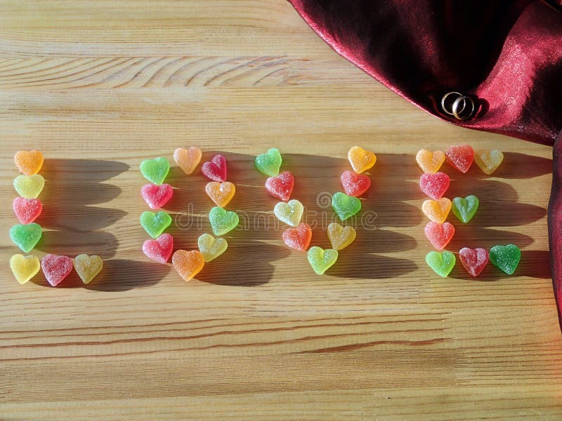 Love Made of Fruit Candy and Wedding Rings Stock Photo - Image of candy ...