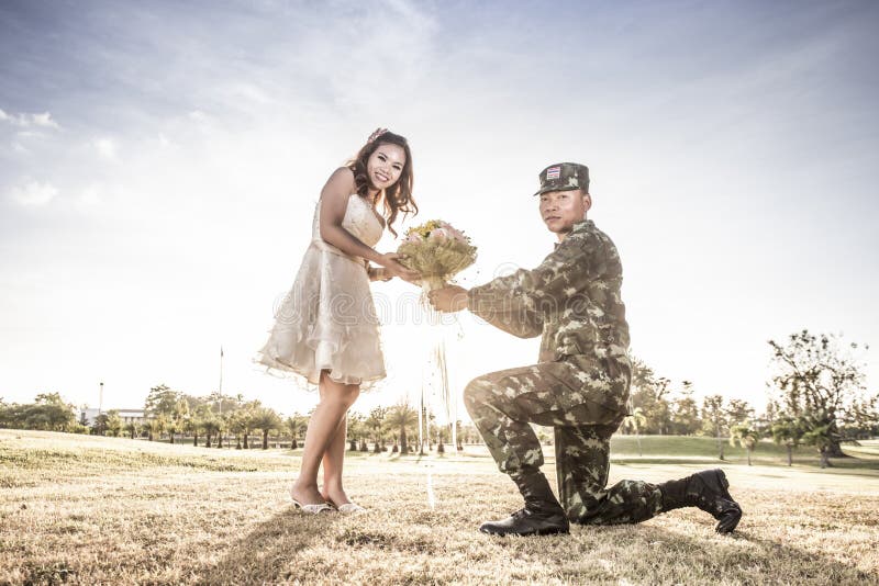 Young Military Couple Kissing Each Other, Homecoming Concept Stock ...