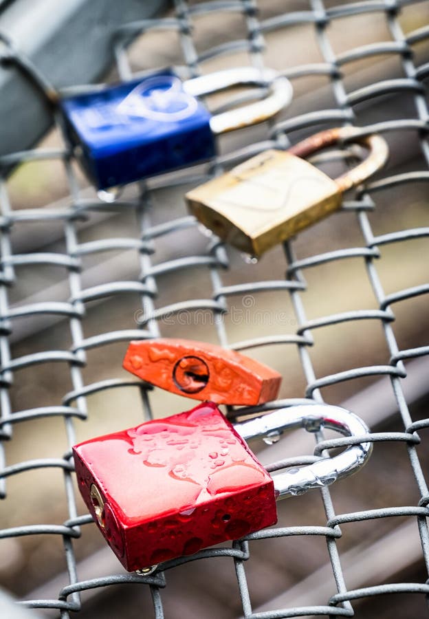 Red Love Padlock in Shaped Heart on Metallic Fence on Bridge in Border ...