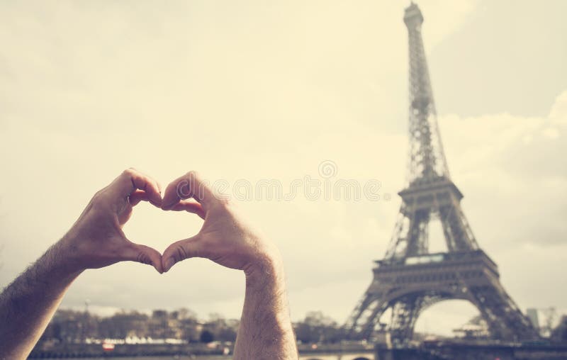 Love in Paris - Hands Forming a Heart Shape in Front of the Eiffel ...