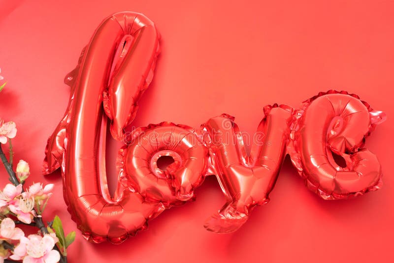 Love Red Foil Balloon with Pink Sakura on Red Stock Photo - Image of ...