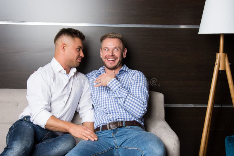 Love and Relationships. Two Happy Guys Together on Couch Stock Image ...