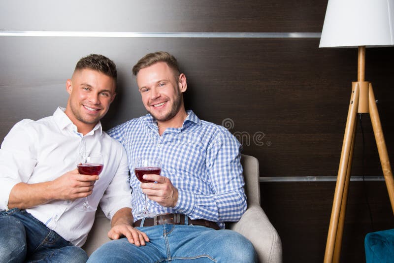 Love and Relationships. Two Married Guys Together on Couch Stock Photo ...