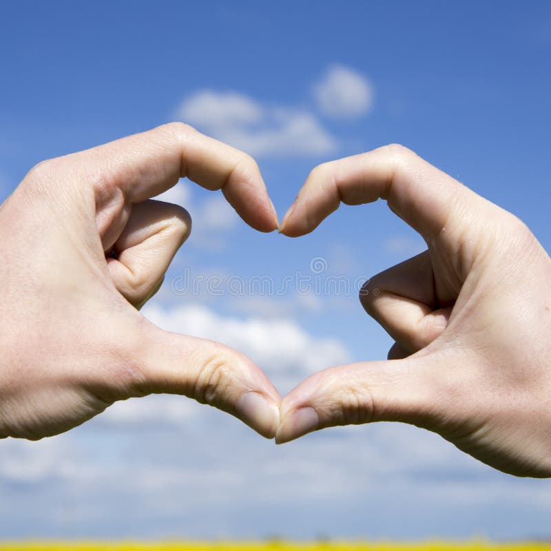 Love Shape Hands - Heart on Yellow Field and Blue Sky Stock Image ...