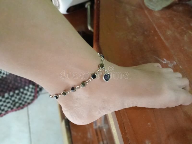 Love shaped anklet stock photo. Image of type, brown - 235917784