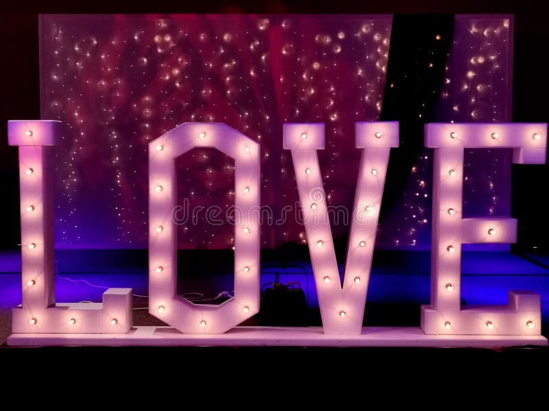 Love sign lit wit lamps stock photo. Image of sign, lamps - 196436850