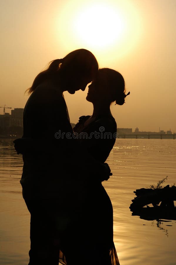 Romantic couple at sunset stock image. Image of kiss, romance - 420783