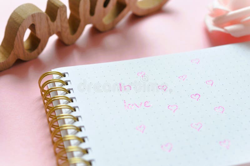 In Love Write in Notepad Next To Love Write and Roses Stock ...
