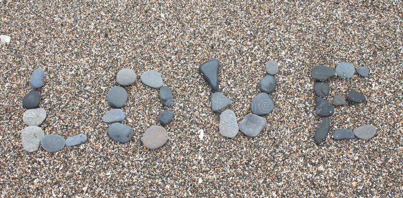 Love Written in Pebbles on a Beach Stock Photo - Image of pebbles ...