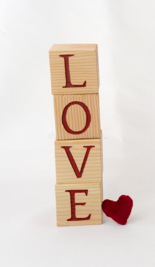 Love Written in Wooden Blocks, Text on Wooden Cubes. Vertical Image ... Love Written in Wooden Blocks, Text on Wooden Cubes. Vertical Image ...