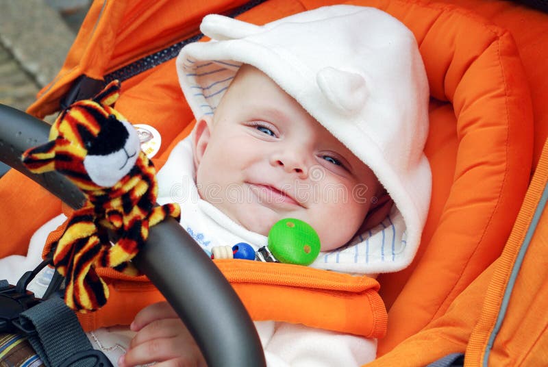Lovely Baby Boy Outdoor in Orange Stroller Stock Photo - Image of ...
