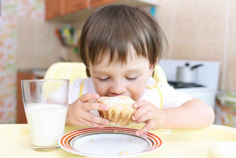 Lovely Baby Eating Cupcake and Milk Stock Image - Image of childhood ...