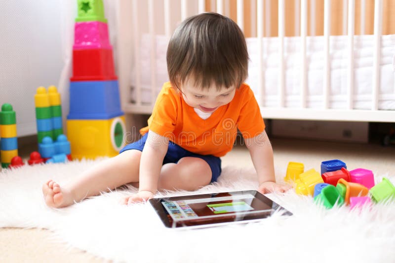 Lovely Baby with Tablet Computer at Home Stock Photo - Image of book ...