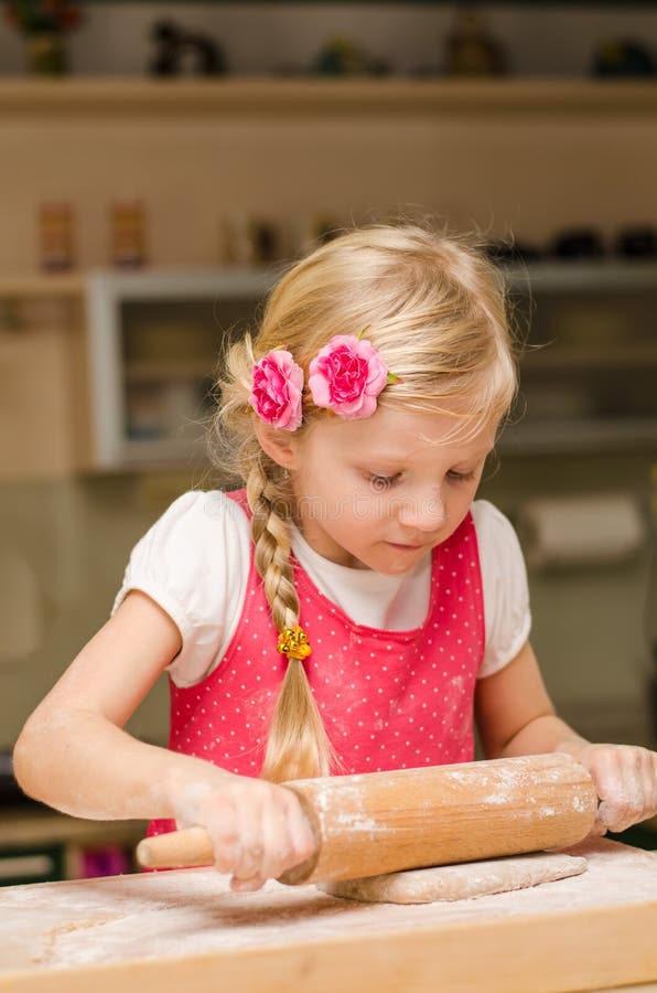 Lovely blond girl baking stock image. Image of childhood - 63390259