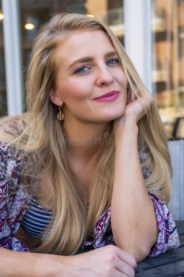 A Lovely Blonde Model Enjoys A Summers Day Outdoors At The Park Stock