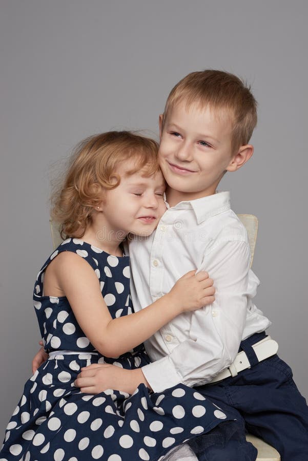 Lovely Boy and Girl Hugging Stock Photo - Image of casual, innocence ...