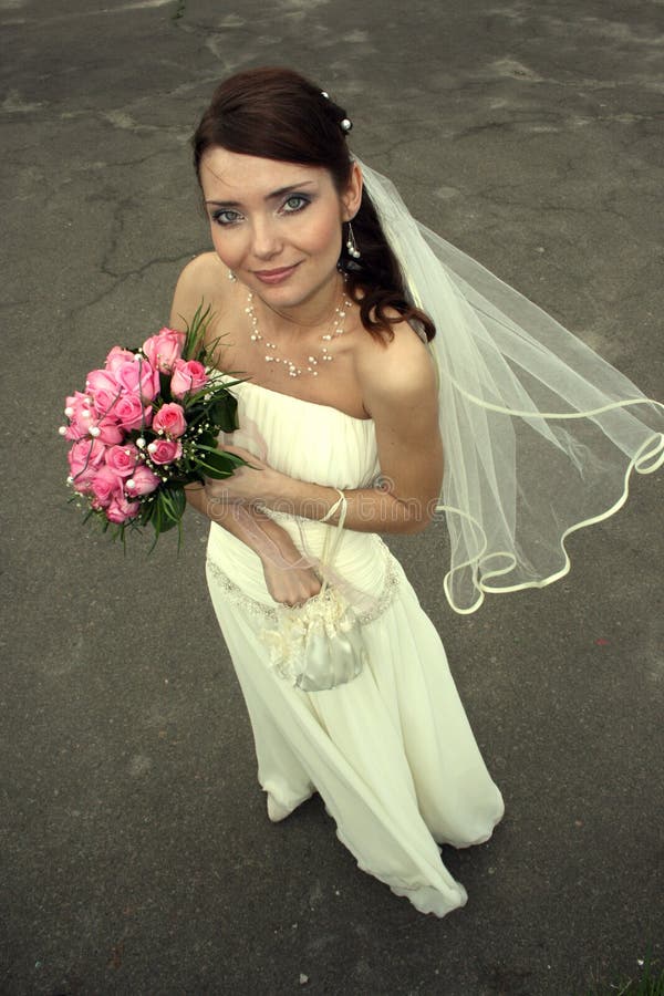 Lovely bride with bouquet stock photo. Image of gazing - 26805372