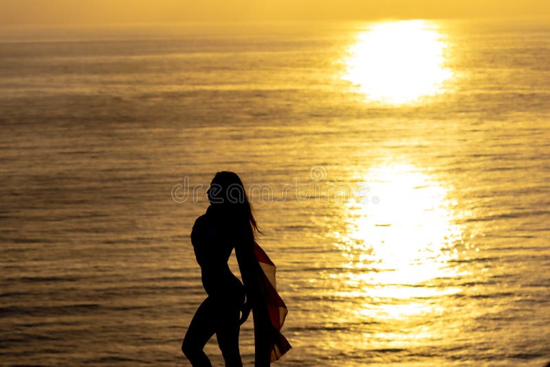 Lovely Brunette Bikini Model Relaxing On The Shoreline At Sunset Stock Image Image Of