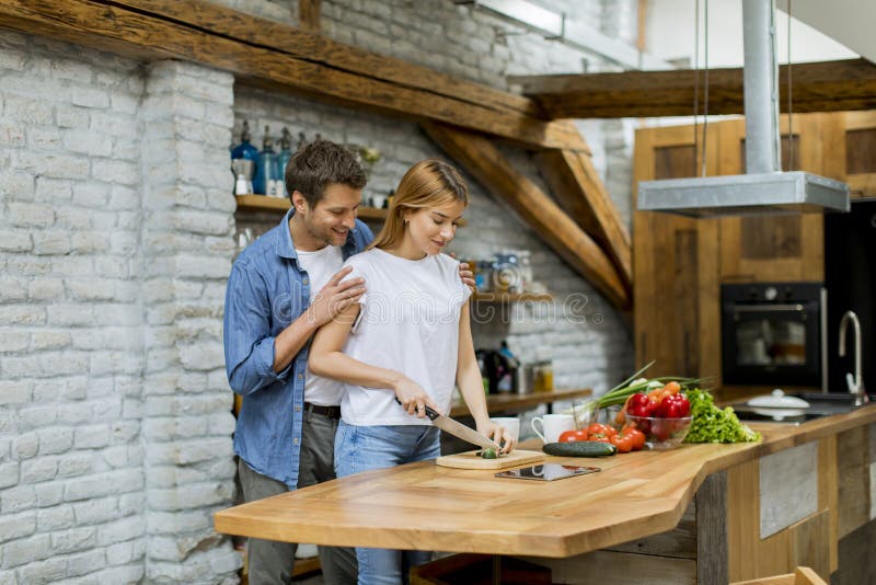 Lovely Cheerful Couple Cooking Dinner Together and Having Fun at Rustic ...