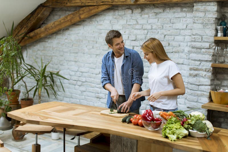 Lovely Cheerful Couple Cooking Dinner Together and Having Fun at Rustic ...