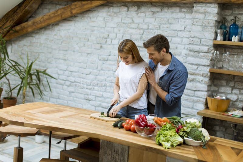 Lovely Cheerful Couple Cooking Dinner Together and Having Fun at Rustic ...