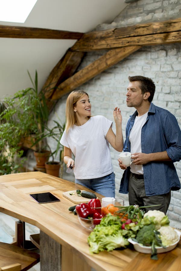 Lovely Cheerful Couple Cooking Dinner Together and Having Fun at Rustic ...