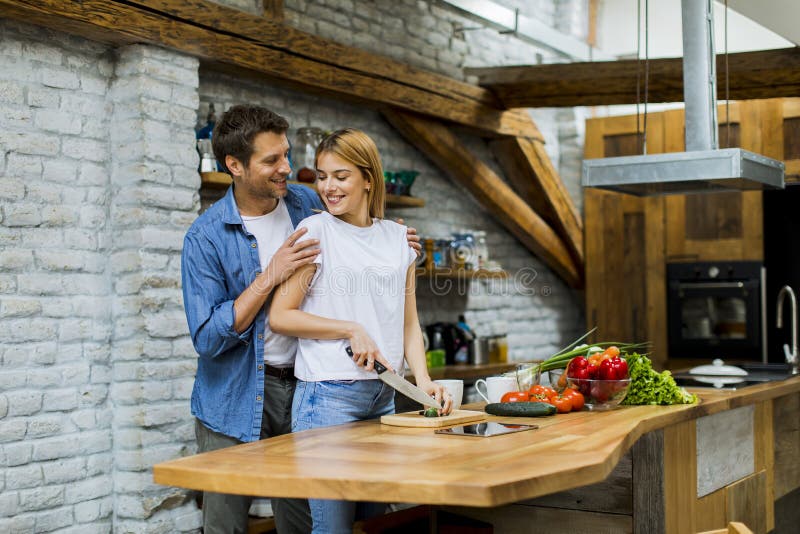 Lovely Cheerful Couple Cooking Dinner Together and Having Fun at Rustic ...