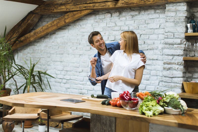 Lovely Cheerful Couple Cooking Dinner Together and Having Fun at Rustic ...