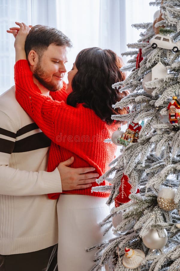 Lovely Couple Dancing in Front of Christmas Tree Stock Photo - Image of ...