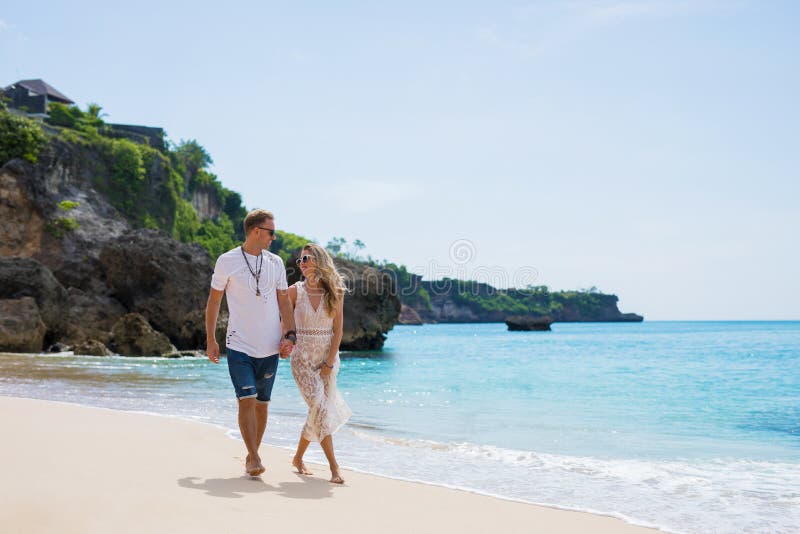 Couple Enjoying Vacation by the Ocean Stock Photo - Image of woman ...