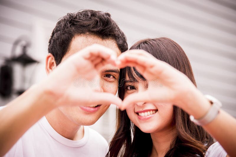 Lovely Couple with Love Hand Sign Stock Photo - Image of hand ...