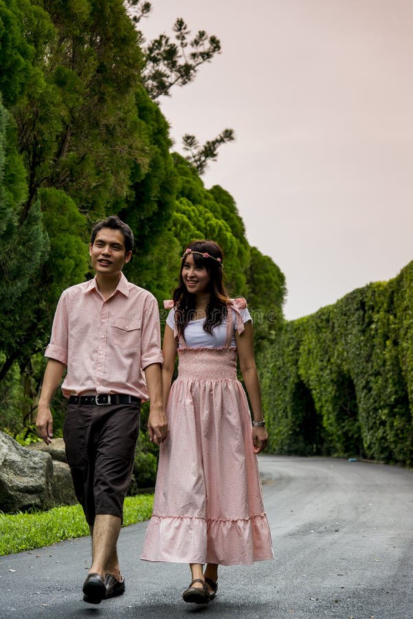 Lovely Couple Walk Together in the Garden1 Stock Photo - Image of ...