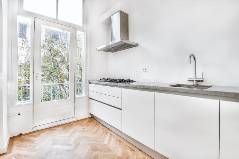Lovely kitchen in daylight stock photo. Image of style - 242854724