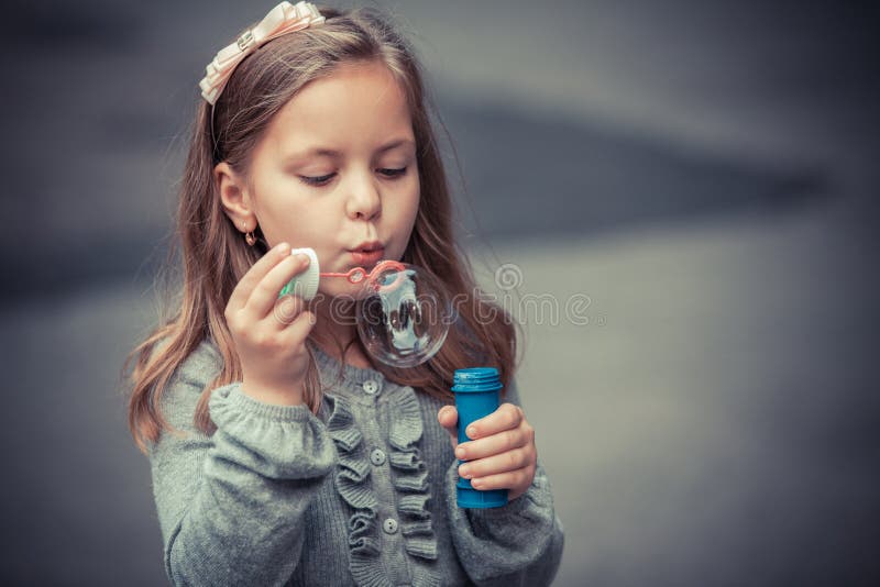 Lovely Little Girl Blowing Soap Bubble Stock Image - Image of happy ... Lovely Little Girl Blowing Soap Bubble Stock Image - Image of happy ...