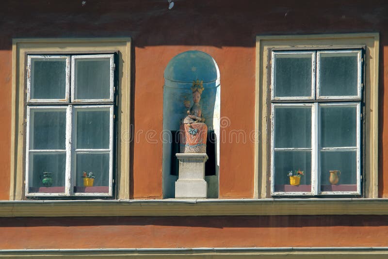 Lovely Sculpture of a Woman between Windows Stock Photo - Image of ...