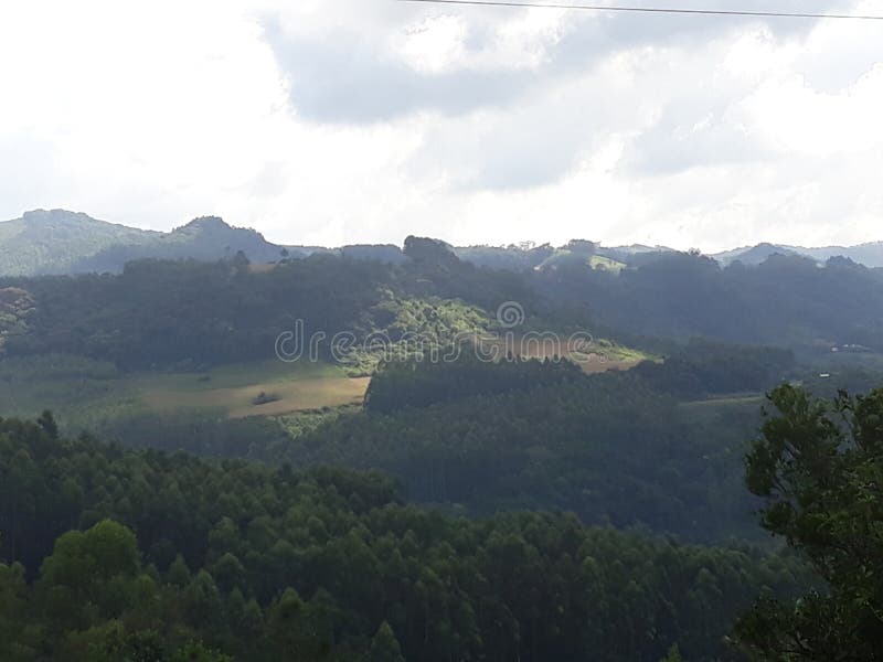 Lovely Setting with Mountains, Grass and Blue Sky Stock Image - Image ...