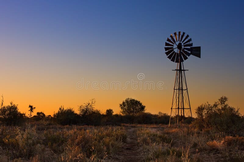 Lovely Sunset in Kalahari with Windmill and Grass Stock Photo - Image ...
