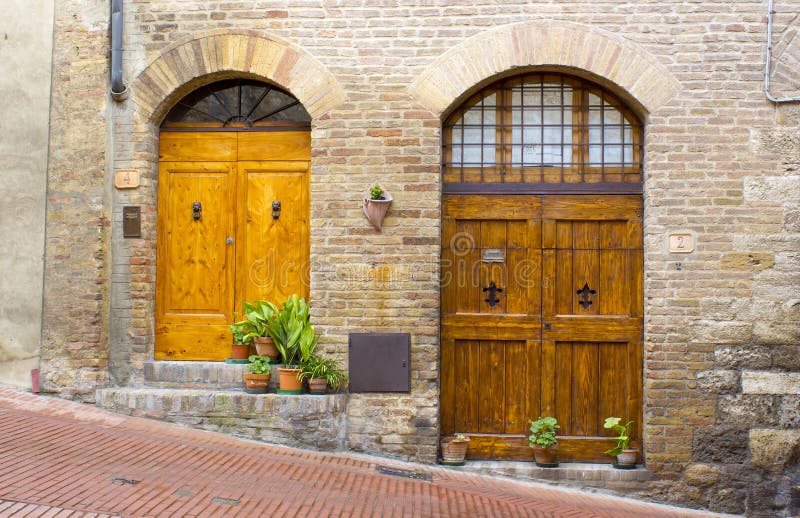 Lovely tuscan doors stock image. Image of ornamental - 11465857