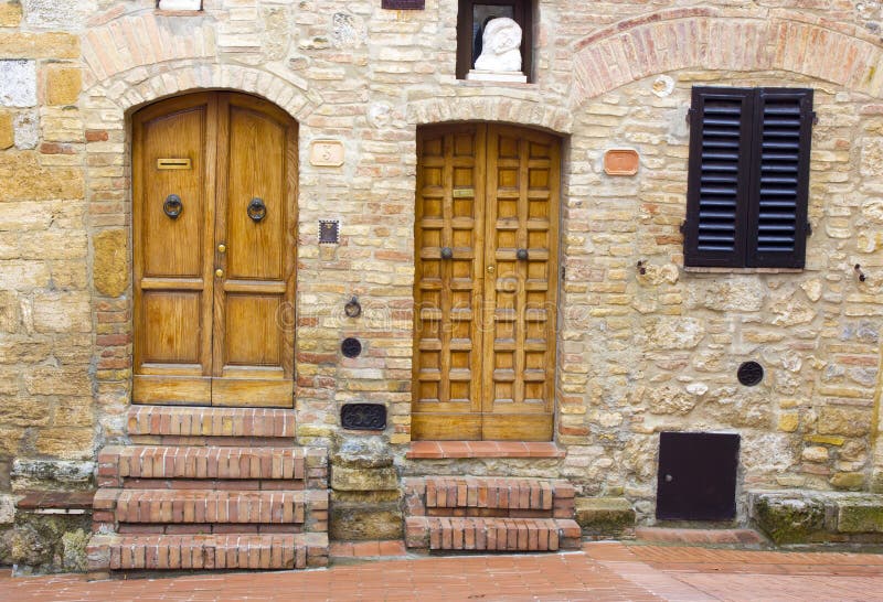 Lovely tuscan doors stock image. Image of ornamental - 11465857