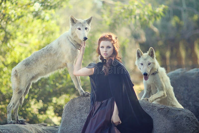 Lovely Woman Posing with Wolves Outdoors Stock Image - Image of glam ...