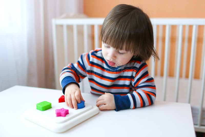Child Playing With Shape Sorter Stock Photo - Image of child, fingers ...