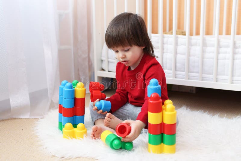 Lovely 2 Years Toddler Playing Plastic Blocks Stock Image - Image of ...