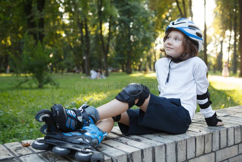Lovely Young Boy Rollerblading in the Park Stock Image - Image of ...