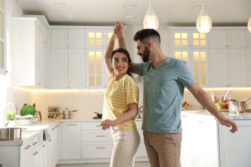 Lovely Couple Dancing in Kitchen. Cooking Together Stock Image - Image ...